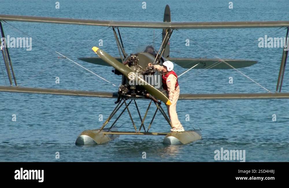 Seaplane U-2/Po-2 (Mule) in water with engine turned off. Pilot turns ...