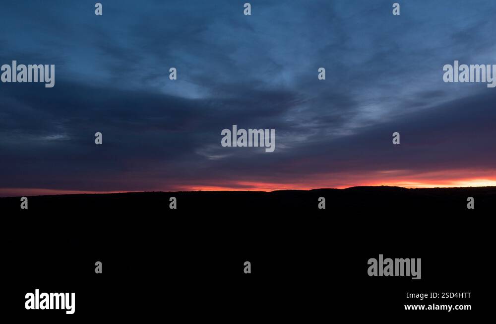 Time lapse over prairie valley as sun rise light on clouds Stock Video ...
