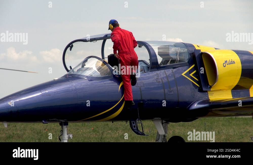 Mechanic installs plugs in the seat of catapult of aircraft L-39. Close ...