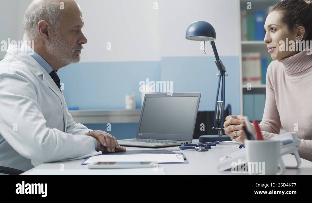 Doctor and patient meeting in the office for a consultation Stock Video ...