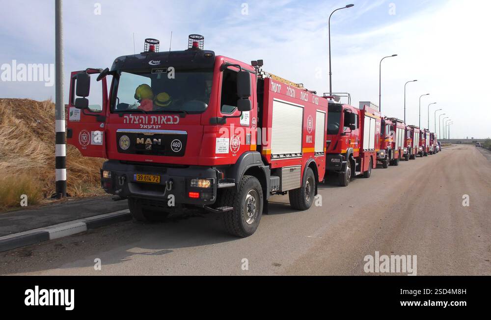 Firefighters trucks gathering and are ready to go to the next fire and ...