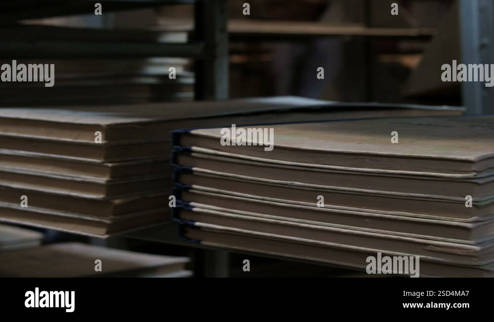 Library or archive room. The camera moves along shelves with documents ...