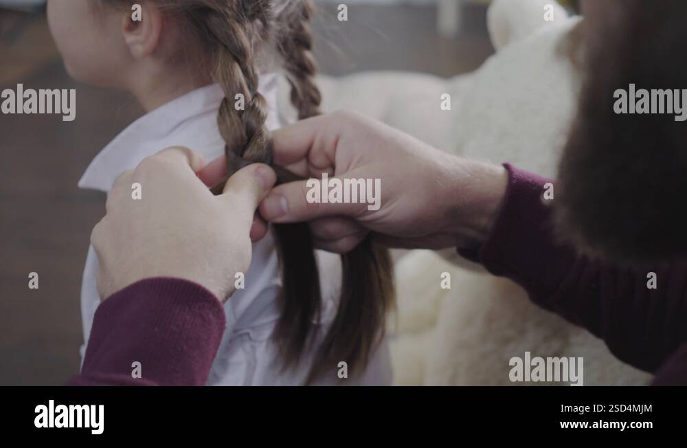 Back view close-up of Caucasian female teen in white shirt sitting on ...