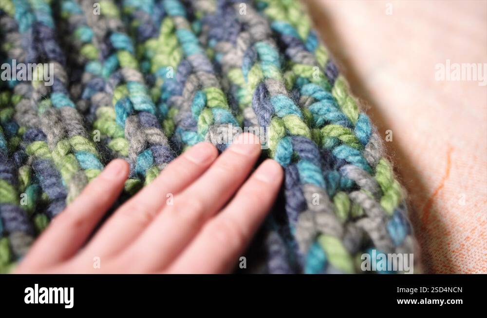 Woman's hand choosing large binding Brioche Stitch thick acrylic synthetic sheep Stock Video ...