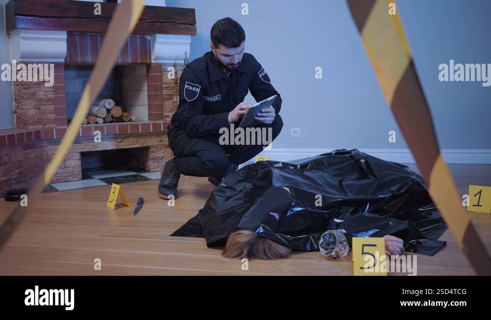 Portrait of Caucasian detective looking around covered body of female ...