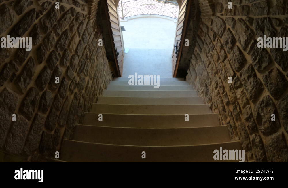 Descent from a high ancient staircase to the open gates, sights and old ...
