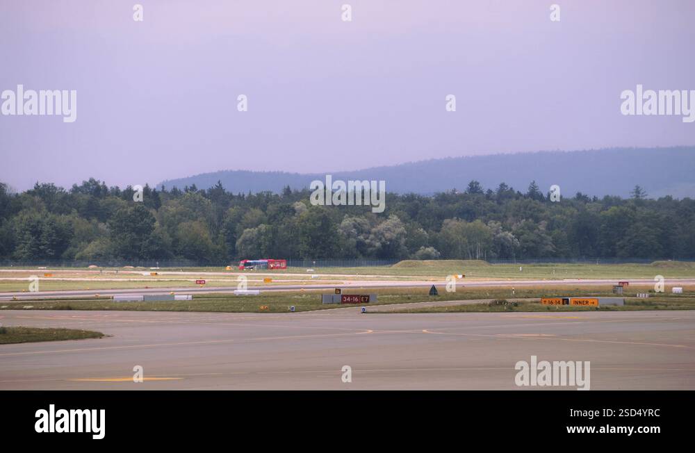 Plane begins to move on the runway. Leaving a trail of exhaust behind ...