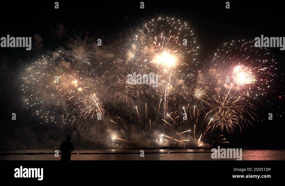 Golden big shiny fireworks with bokeh lights in the night sky. Glowing ...