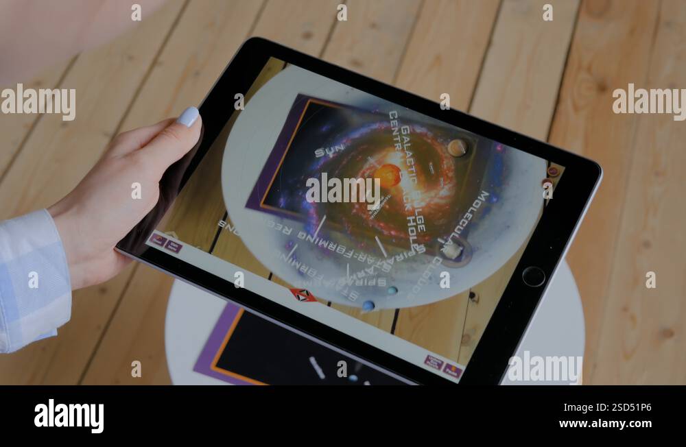 Woman using tablet with augmented reality app - 3d planets of solar ...