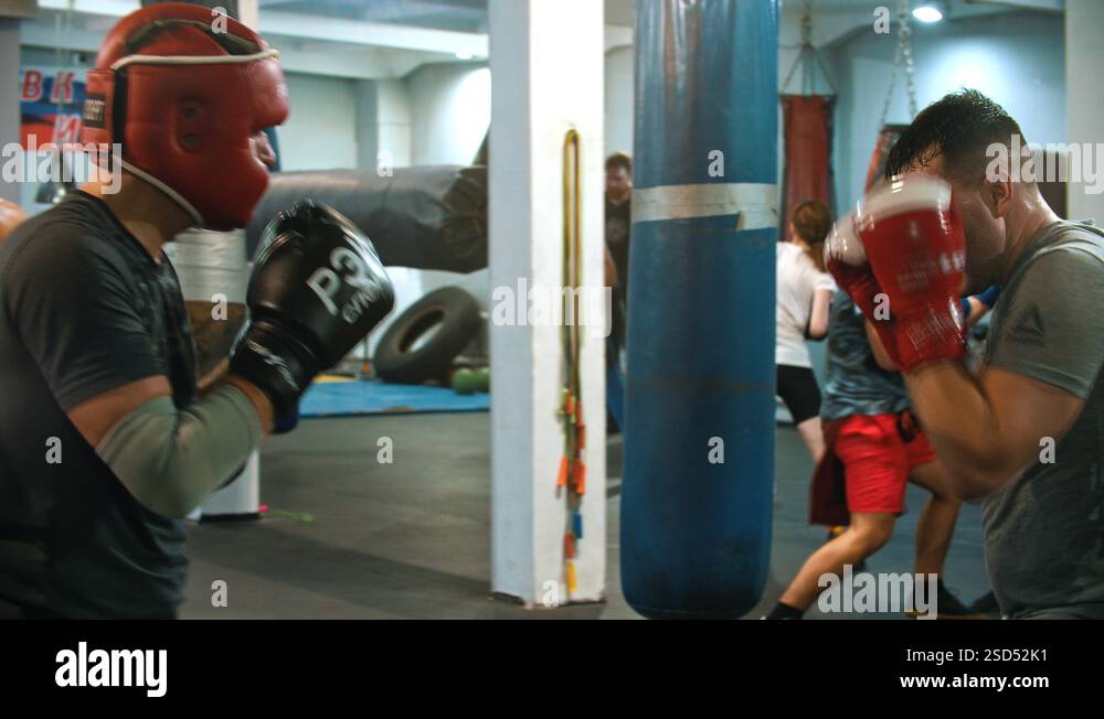 RUSSIA, KAZAN 29-11-2019 BOXING SCHOOL - two men in boxers gloves are ...
