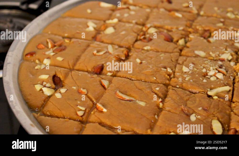 Smooth panning shot of Indian sweets, Besan burfi, healthy and ...