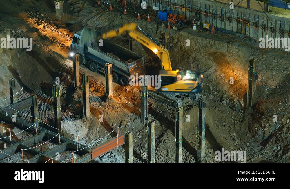 Excavation works at construction site, remove ground from basement area ...