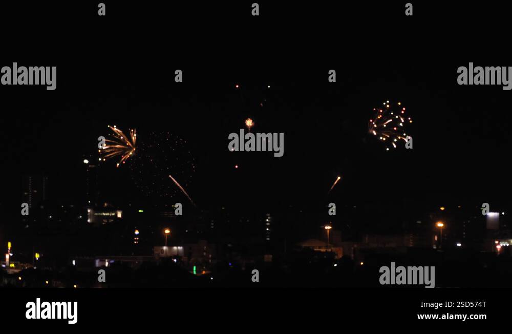 4k. Golden big shiny fireworks with bokeh lights in the night sky Stock ...