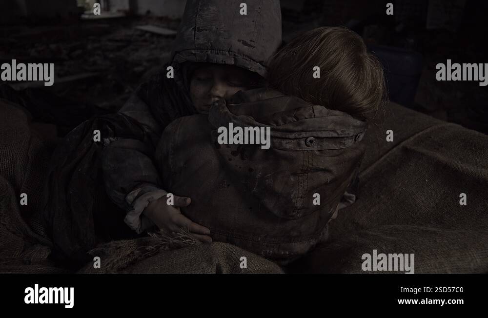 Homeless children hug each other in support of the ruins. Apocalypse ...