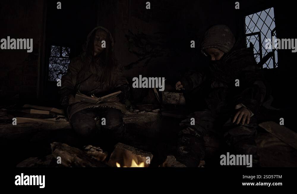 Homeless children bask in the ruins of a campfire. Apocalypse. War ...