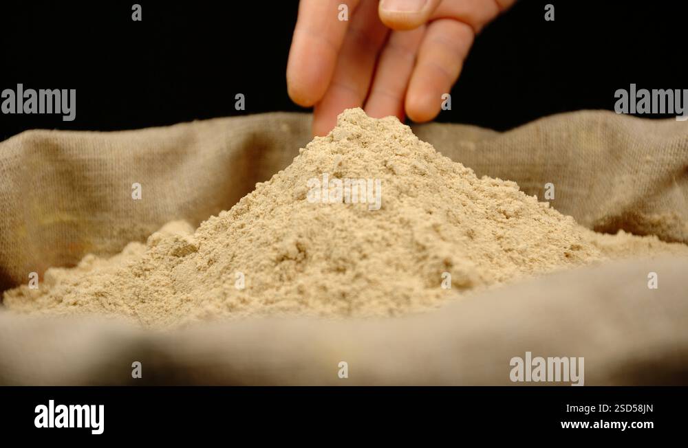 Male hand takes a pinch of a ginger powder from a top of pile Stock ...