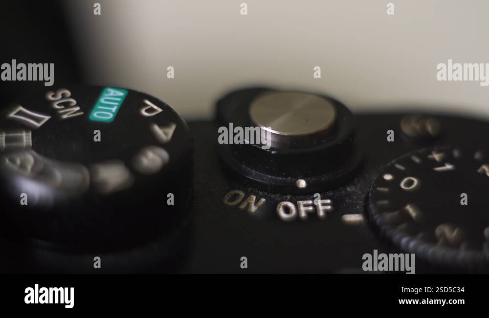 Extreme close up man turning on old dirty camera with dust on it Stock ...