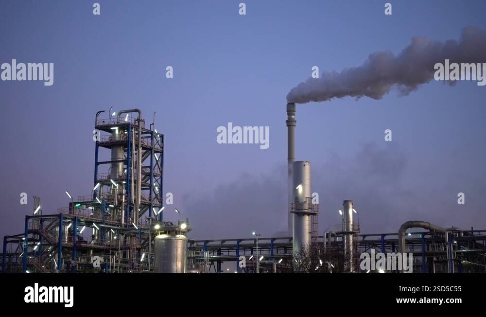 Chemical plant pumping out smoke and steam. Industrial air pollution ...