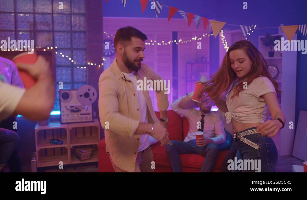 Esctatic handsome couple of best friends dancing together making a fun ...