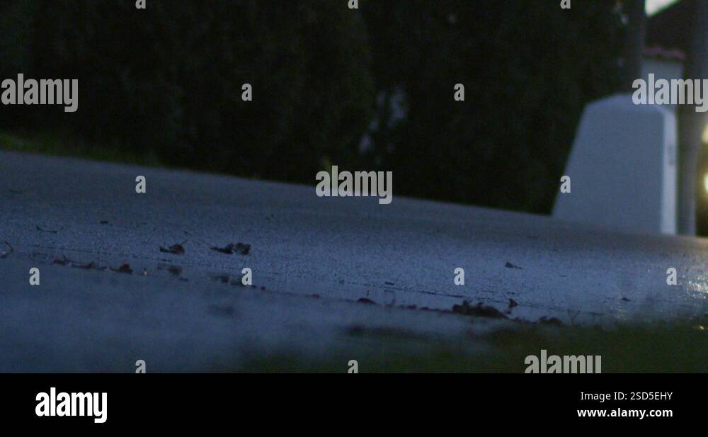 Slow Motion. Murky Splashes Across Asphalt Road As Car Drives Into ...