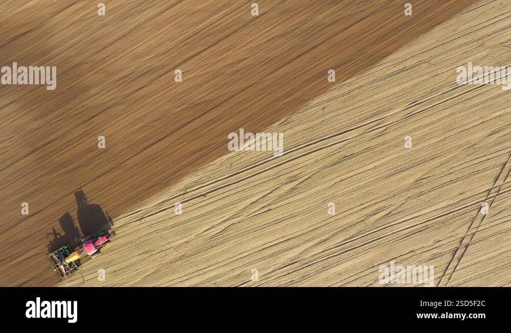Tractor Planting Seeds Of Grain Crops In Agricultural Field Aerial Top ...