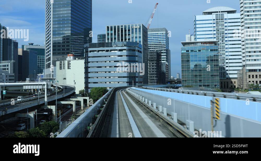 A front point of view on the railway at Yurikamome line in Tokyo Stock ...