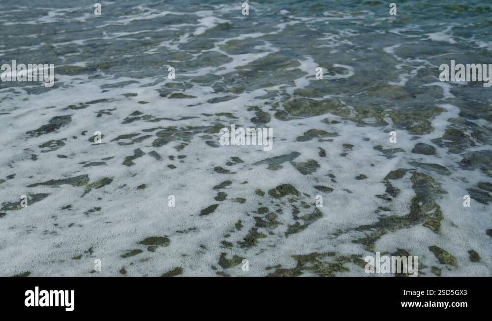Tropical beach close up view, Top view of waves break on yellow sand ...