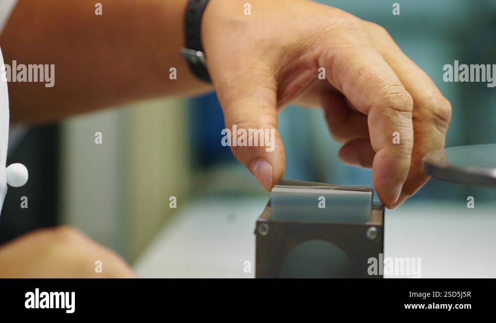 worker puts workpiece under tool tip in radio set workshop Stock Video ...