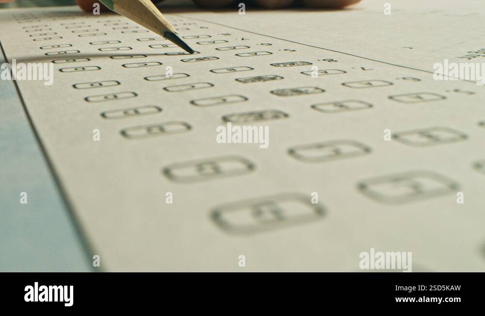 On Exam Test Person Colors Right Answers with a Pencil. Filling up ...