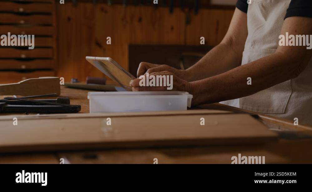 Female luthier at work in her workshop Stock Video Footage - Alamy