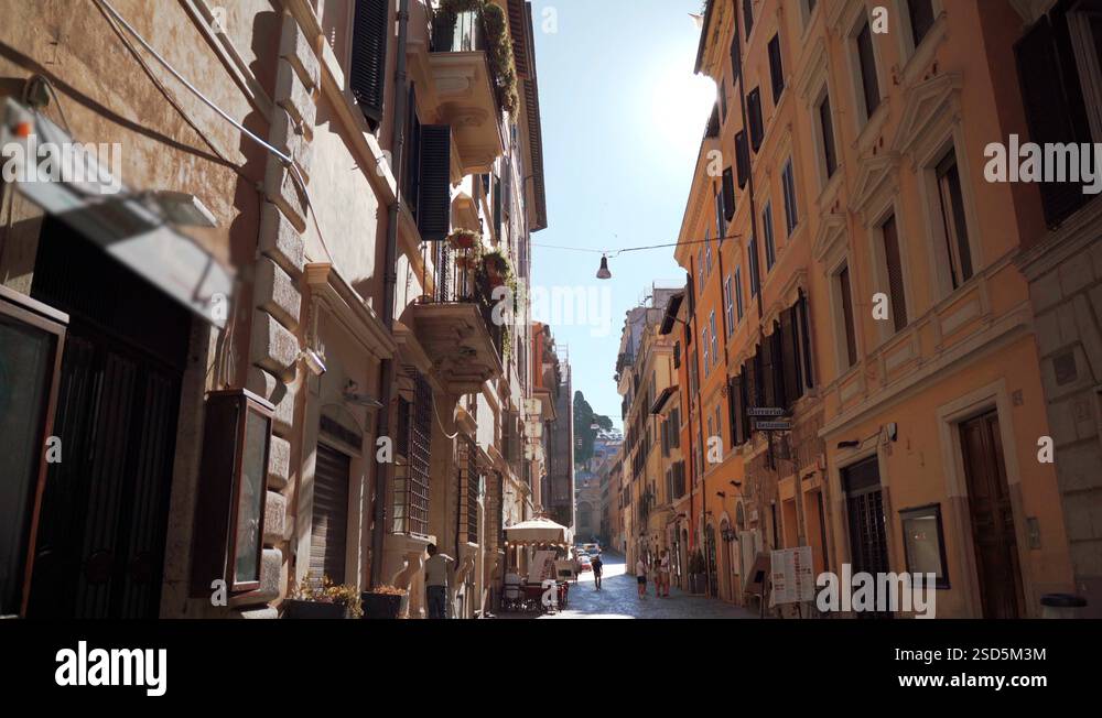 Sunny ancient Roman street with old majestic buildings of the times of ...