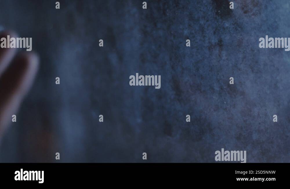 Man's Hand gently touching window glass. Expressing sad feelings ...