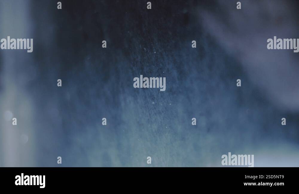 Upset woman touching window glass with her hand expressing feelings and ...