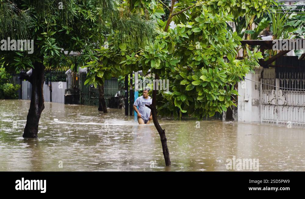 Man walking on flooded street during heavy raining Stock Video Footage ...