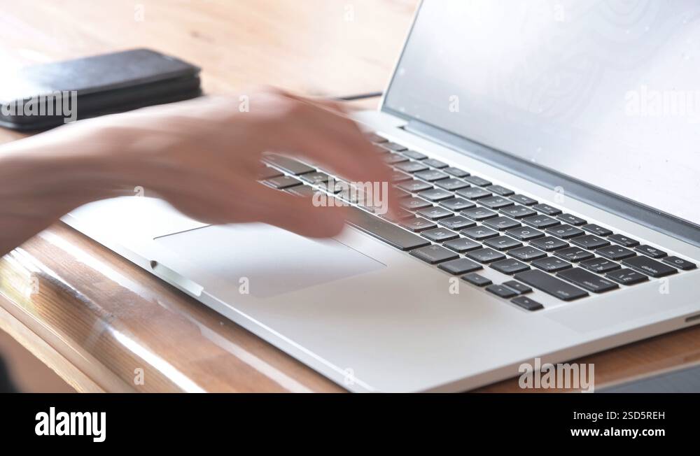 Male hand is typing on laptop, presses space bar. Man works in program ...