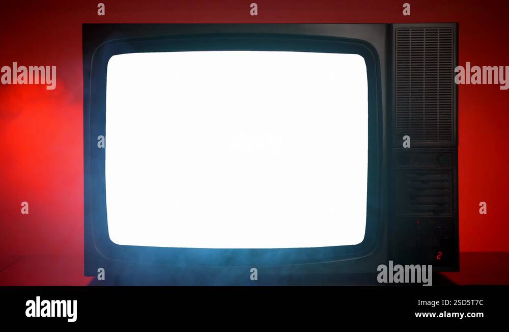 Old vintage television with blinking white screen on red background ...