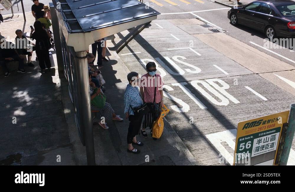 people at bus stop on Hong Kong Island Stock Video Footage - Alamy