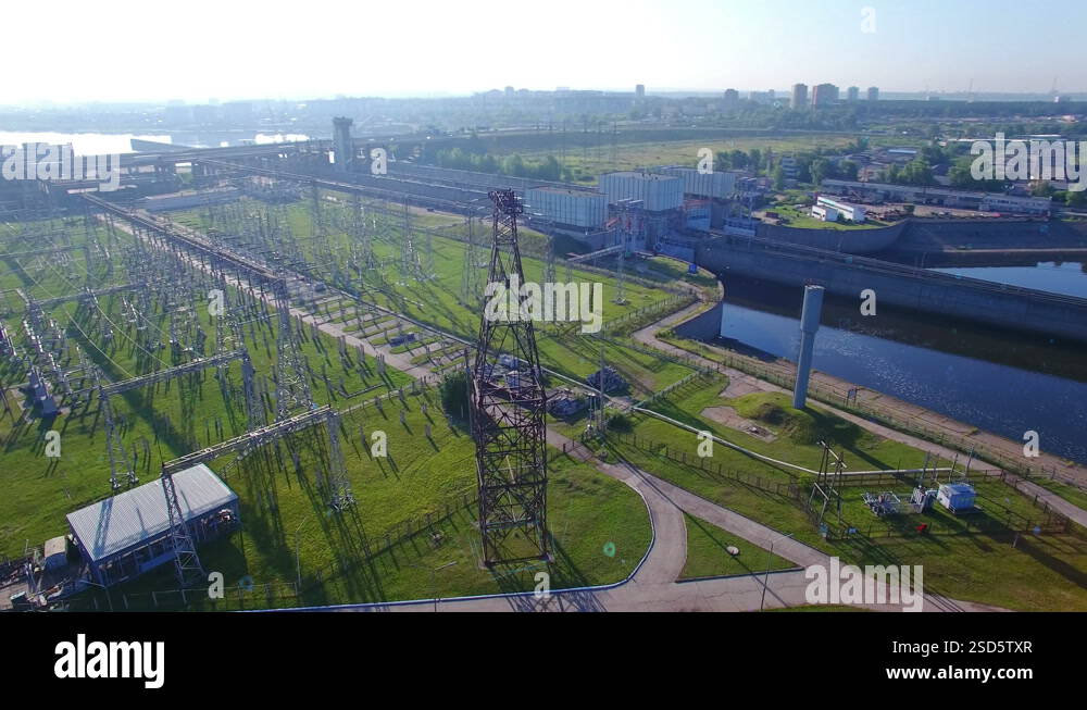 An aerial circular orbit view, high voltage electric power tower with ...