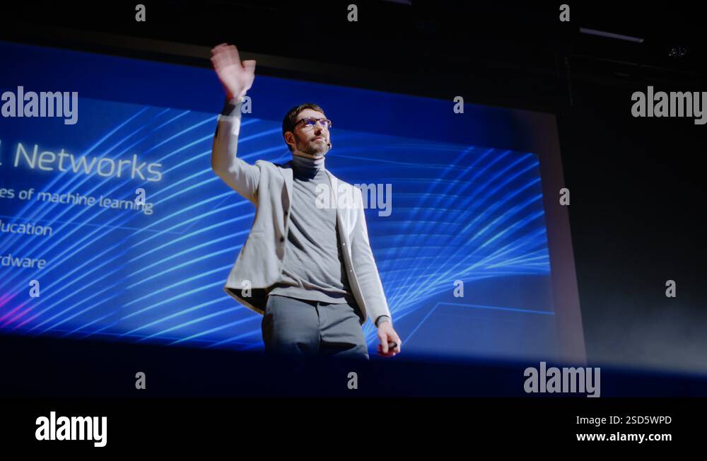 On-Stage Speaker Greets Audience Presentation of Technological Device ...