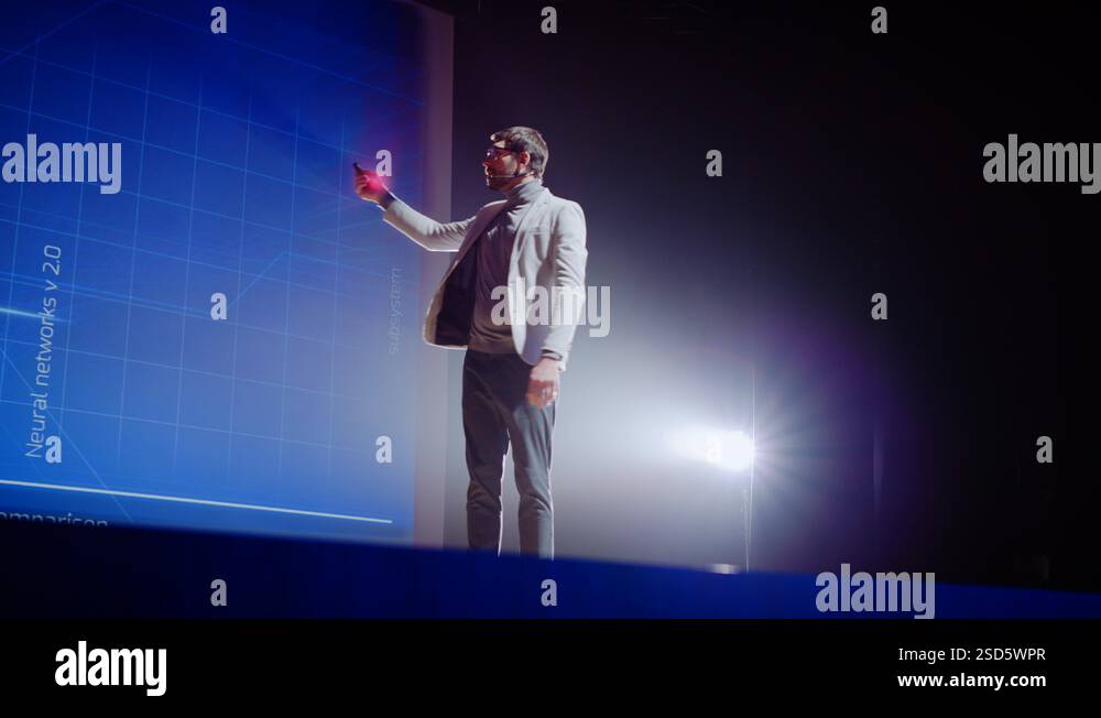 On-Stage Speaker Greets Audience Presentation of Technological Device ...