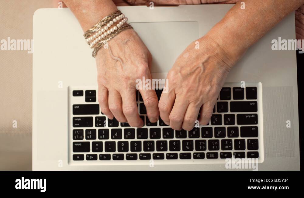 Senior Woman Typing On Laptop Keyboard.Elderly Hands Typing On Computer ...