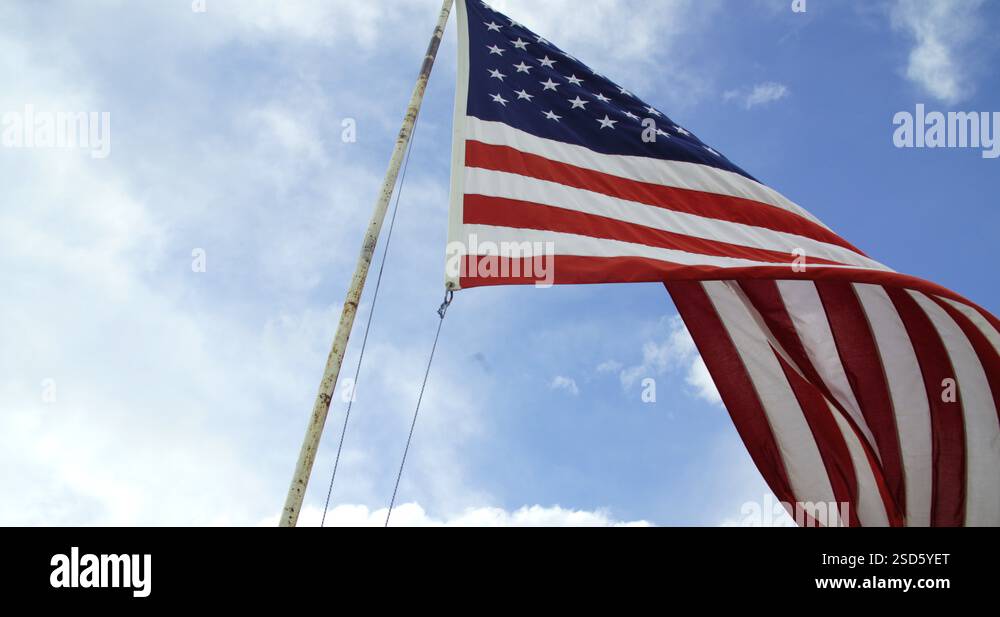 Real american flag in slow motion attached to rusty flag pole Stock ...