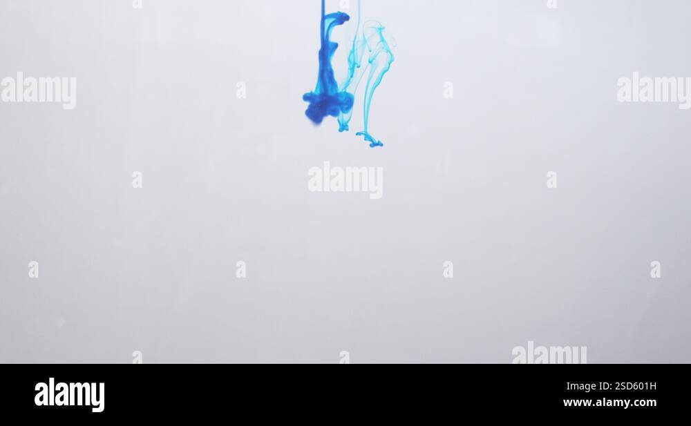 Blue color paint ink drops in water at white background. Inky cloud ...