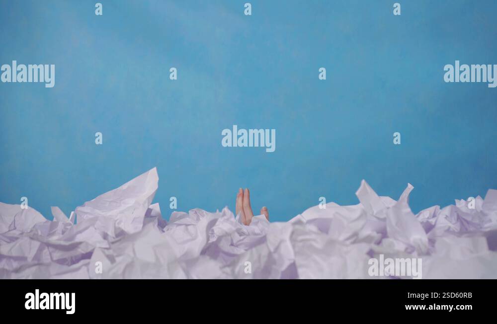 hand reaches out from a large heaps of crumpled paper Stock Video ...