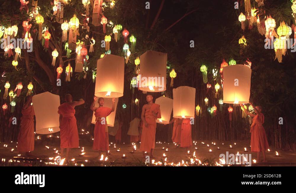 Thai Buddhist monks release Lanna lantern during Yi Peng Festival Stock ...
