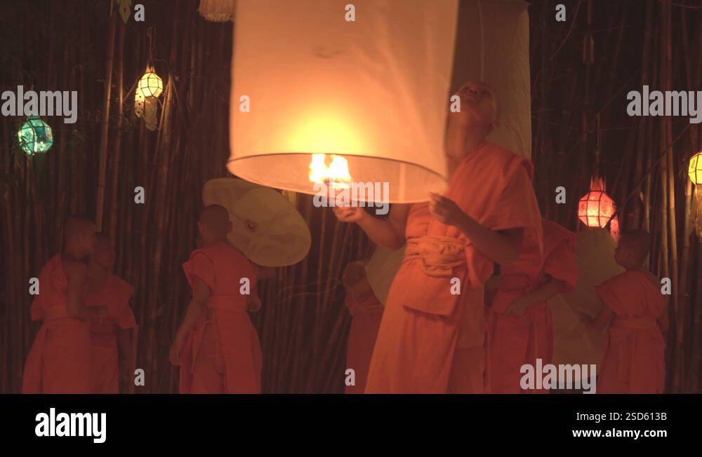 Thai Buddhist monks release Lanna lantern during Yi Peng Festival Stock ...