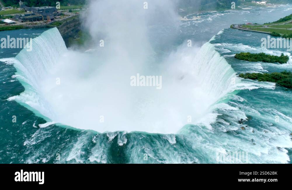 The mist and spray from the crashed water gets higher over the ...