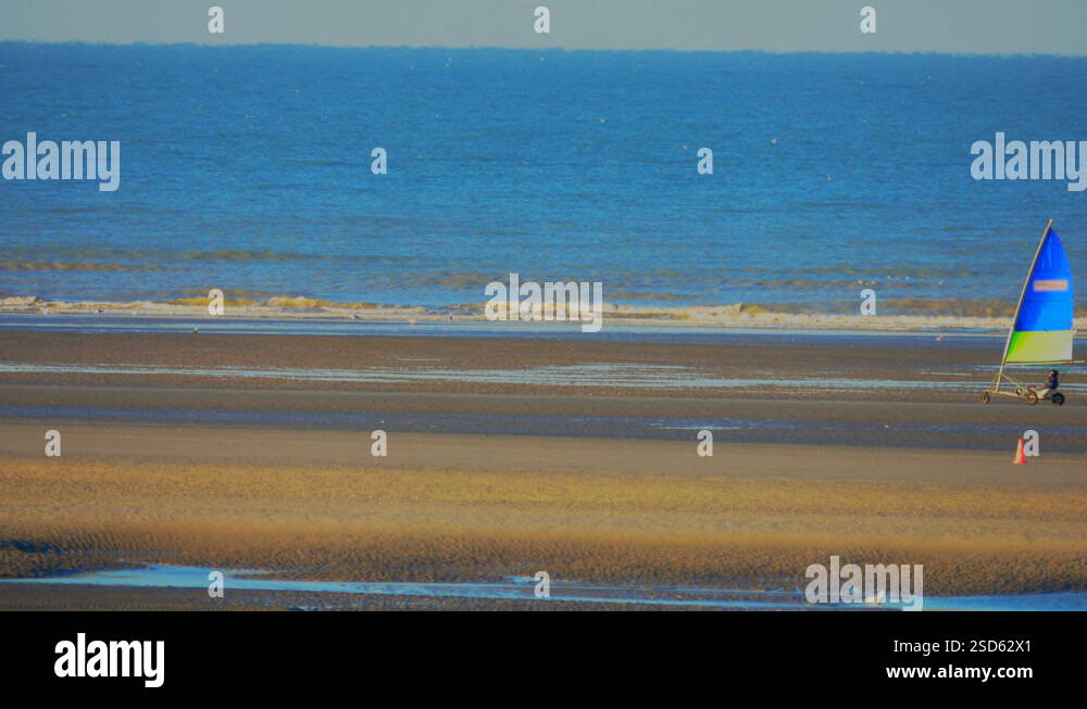 Two land sailing carts are riding on the beach Stock Video Footage - Alamy