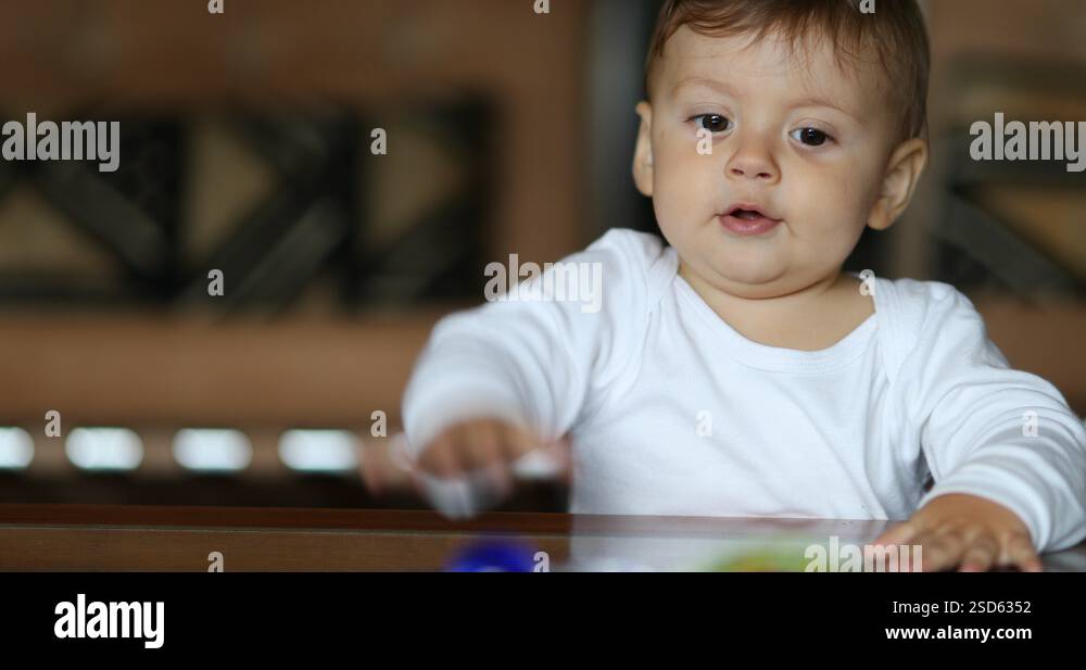 Funny baby hitting table with hand and arm Stock Video Footage - Alamy