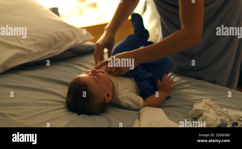 Mother changing baby before bed. Family night routine Stock Video ...